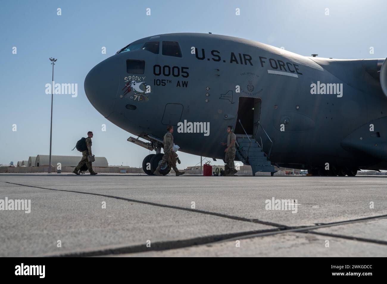 U.S. Air Force Airmen step to a C-17 Globemaster III assigned to the ...
