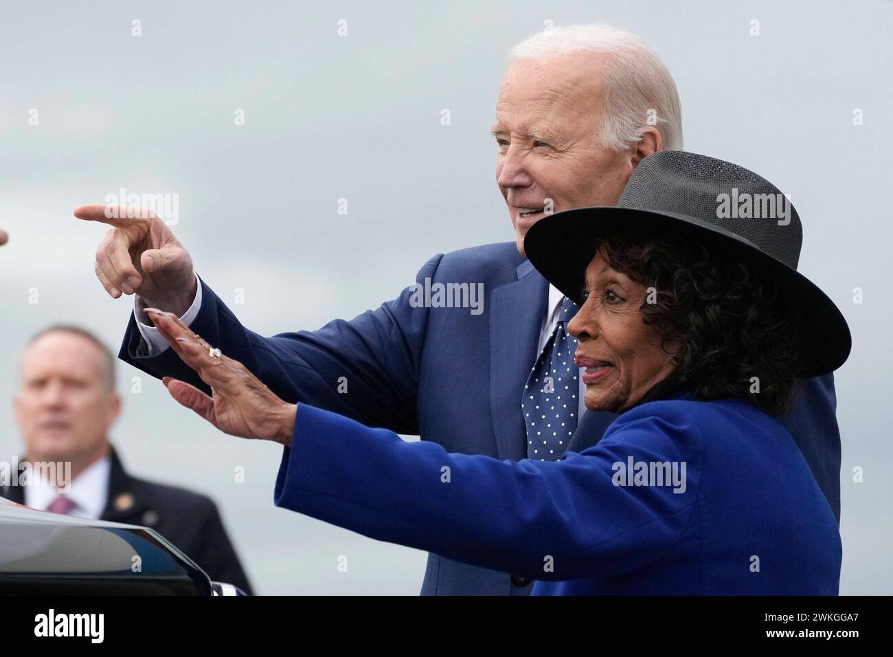 President Joe Biden waves with Rep. Maxine Waters, D-Calif., as he ...