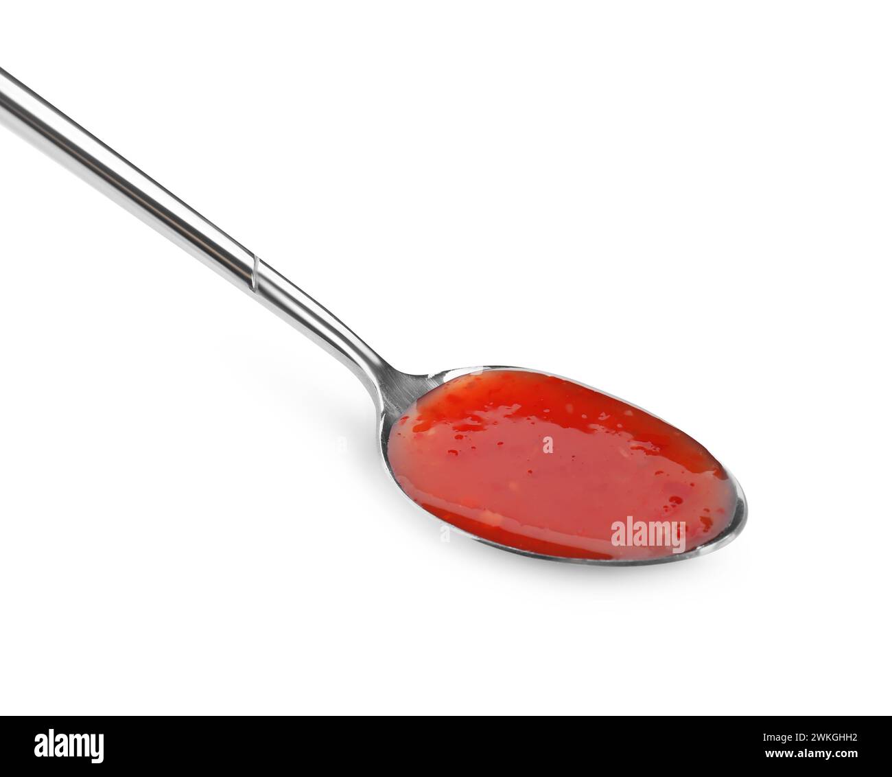 Spicy chili sauce in spoon isolated on white Stock Photo - Alamy