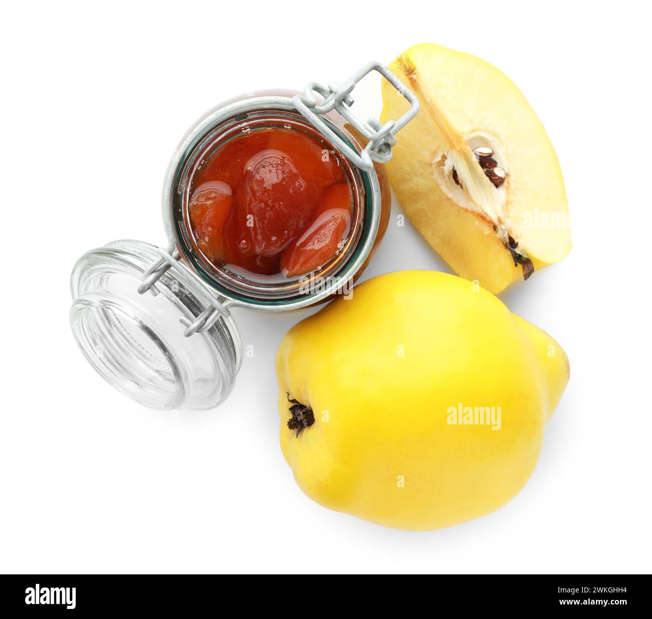 Tasty homemade quince jam in jar and fruits isolated on white, top view ...