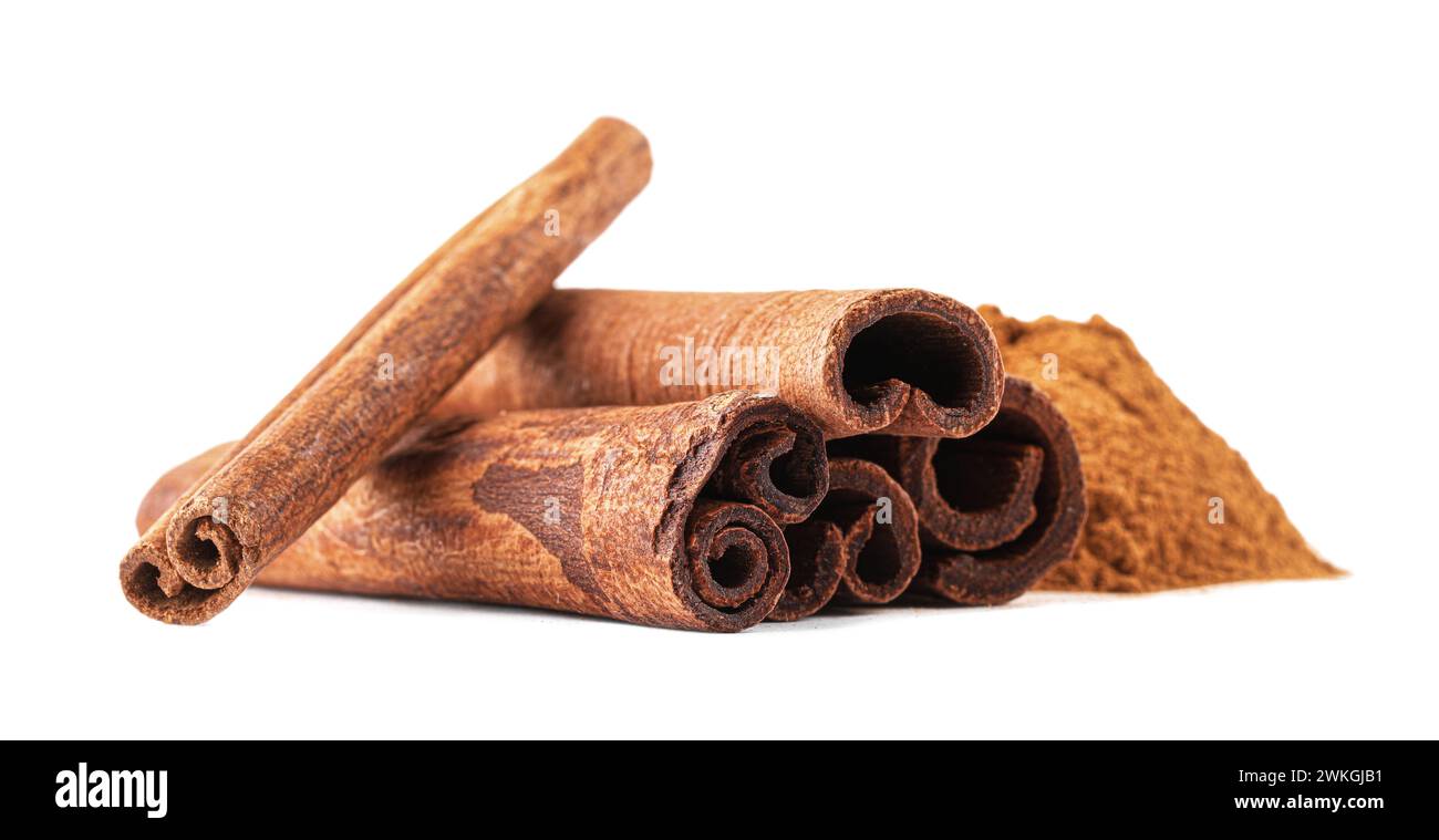 Dry aromatic cinnamon sticks and powder isolated on white Stock Photo ...
