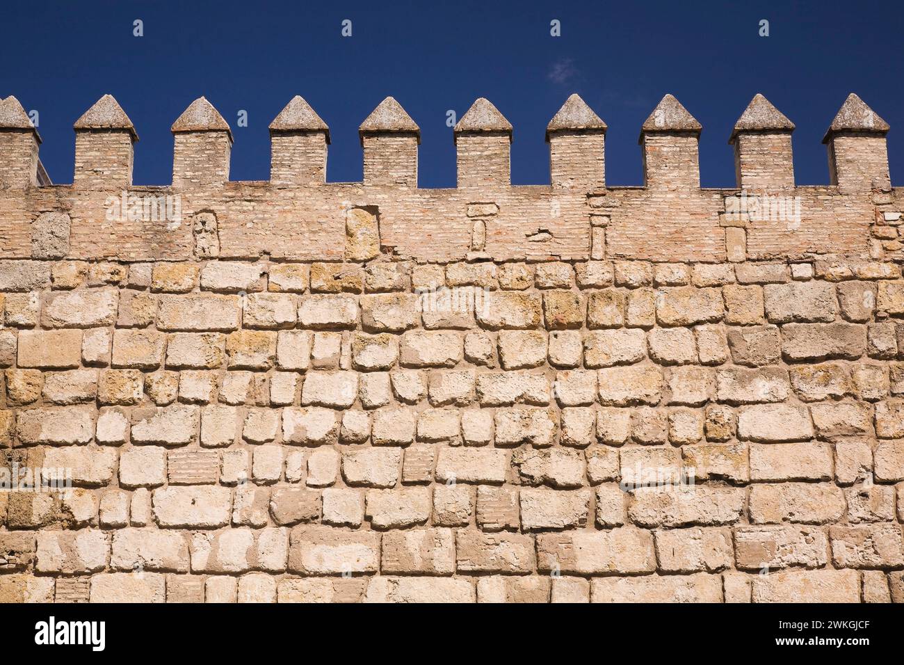 Old fortified stone wall with parapets, Seville, Spain Stock Photo - Alamy