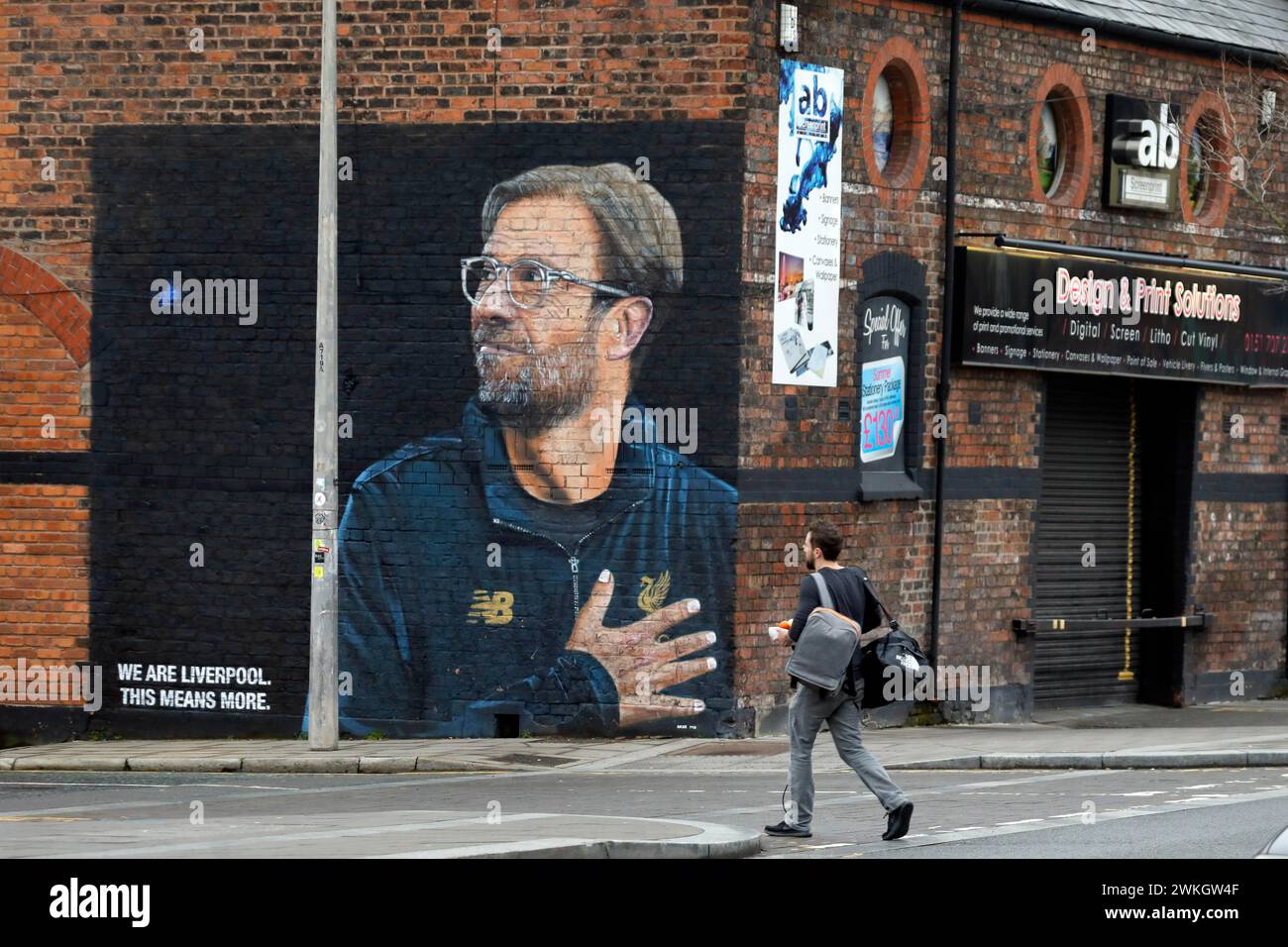 A large poster with a picture of Juegen Klopp, the coach of Liverpool ...