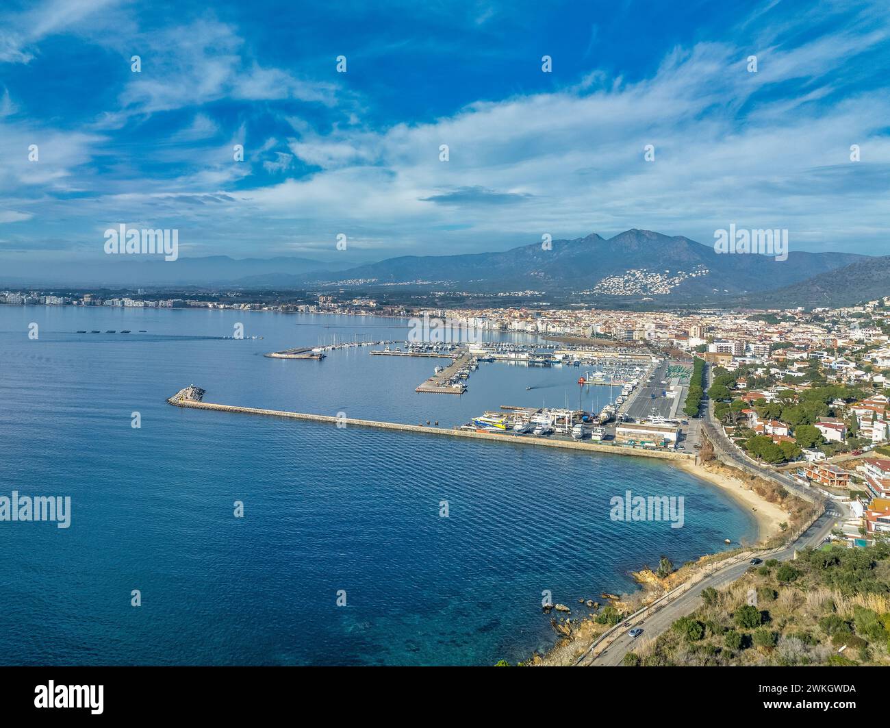 Aerial view of the Golf of Roses in Spain with deep blue water, sky ...