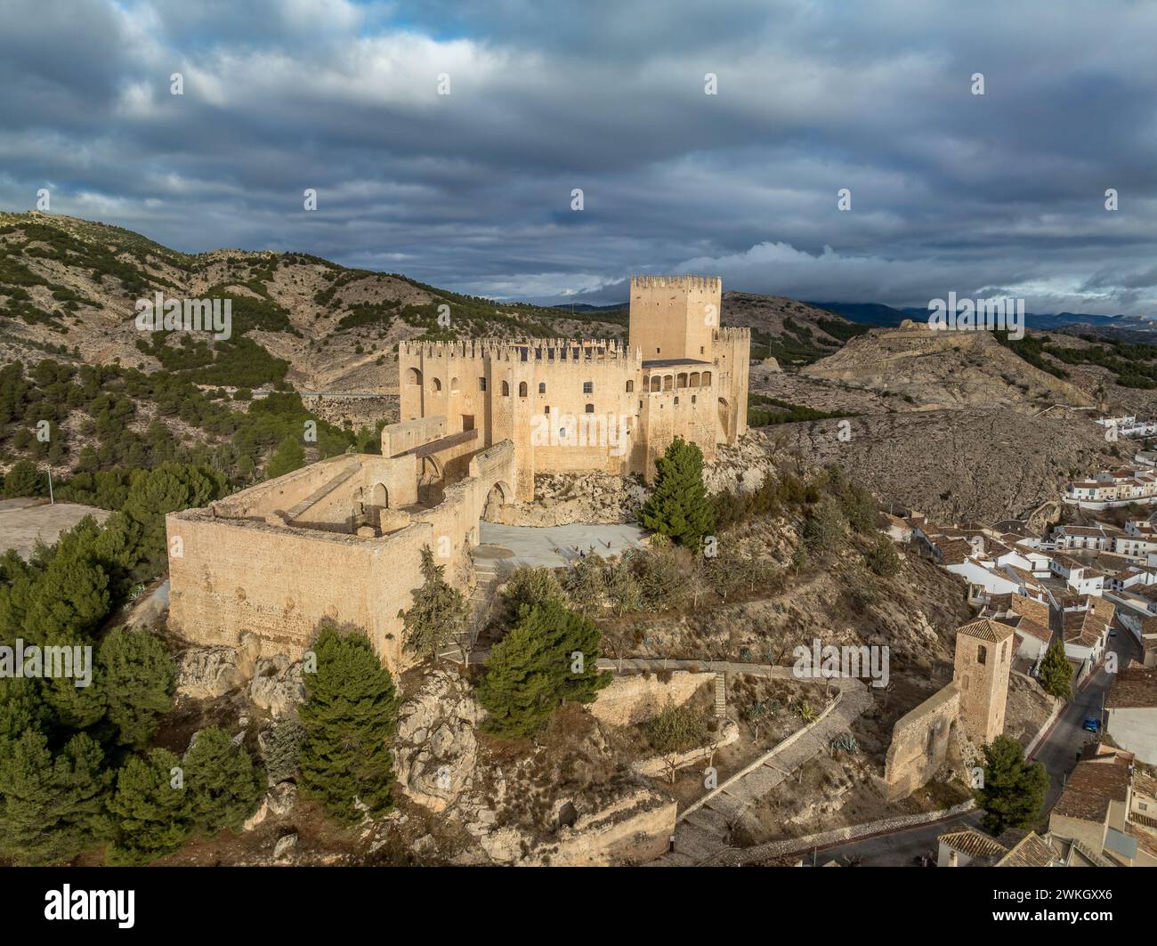 Aerial view of Velez Blanco castle on a hilltop and town with one or ...