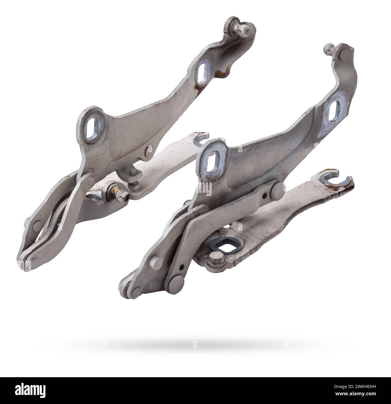 Pair of hinges for attaching the hood or trunk of the car on a white ...