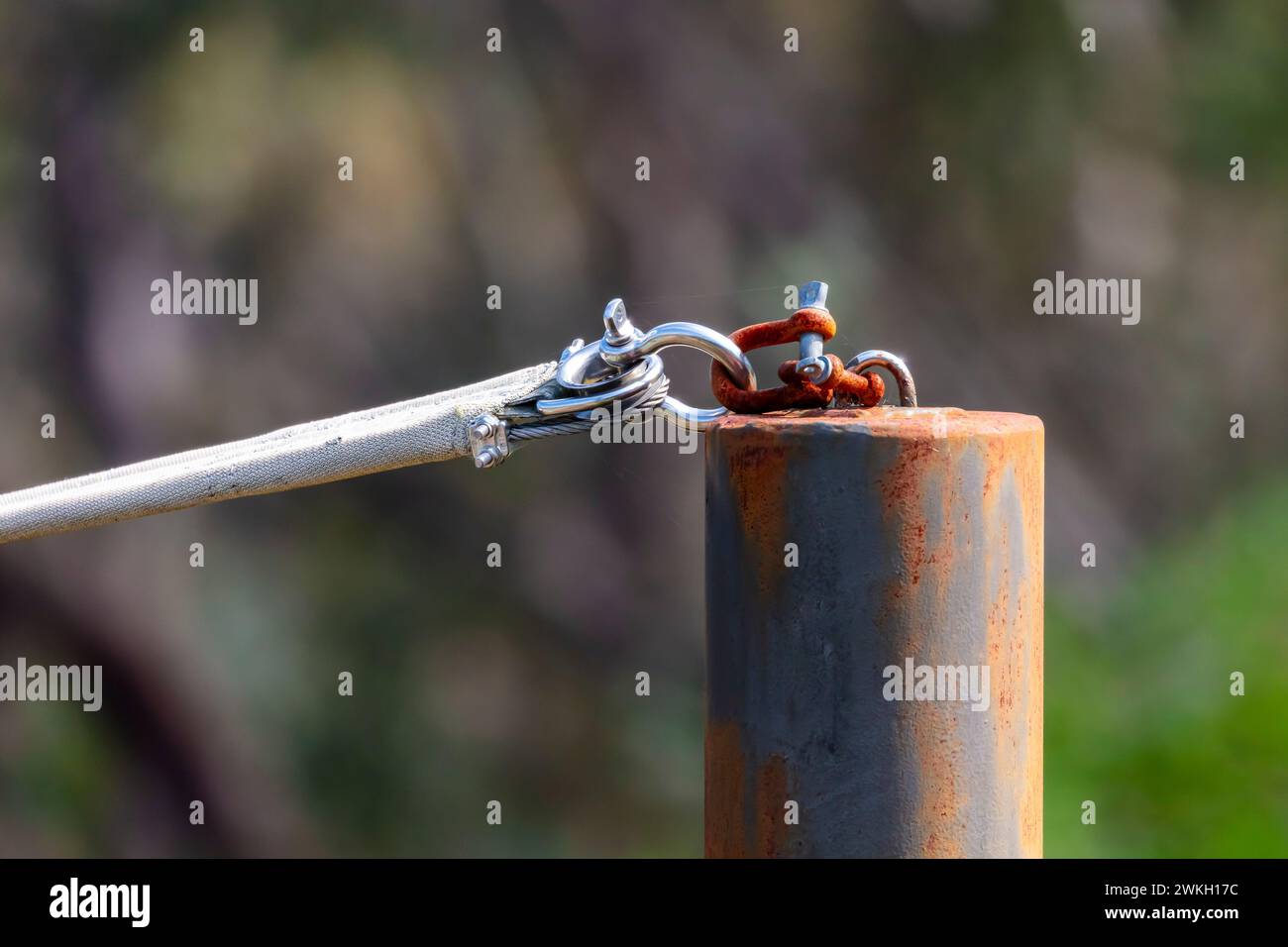 Photograph of a rusty shackle attached to a stainless steel connector ...