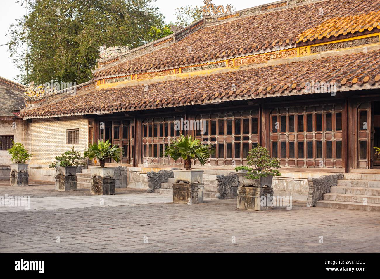 A serene courtyard showcases classical Vietnamese house, featuring an ...