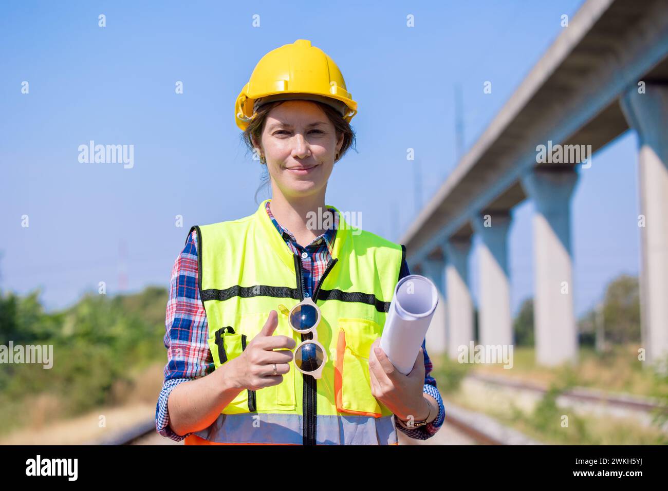 Portrait engineer women on railway tracks construction site with ...