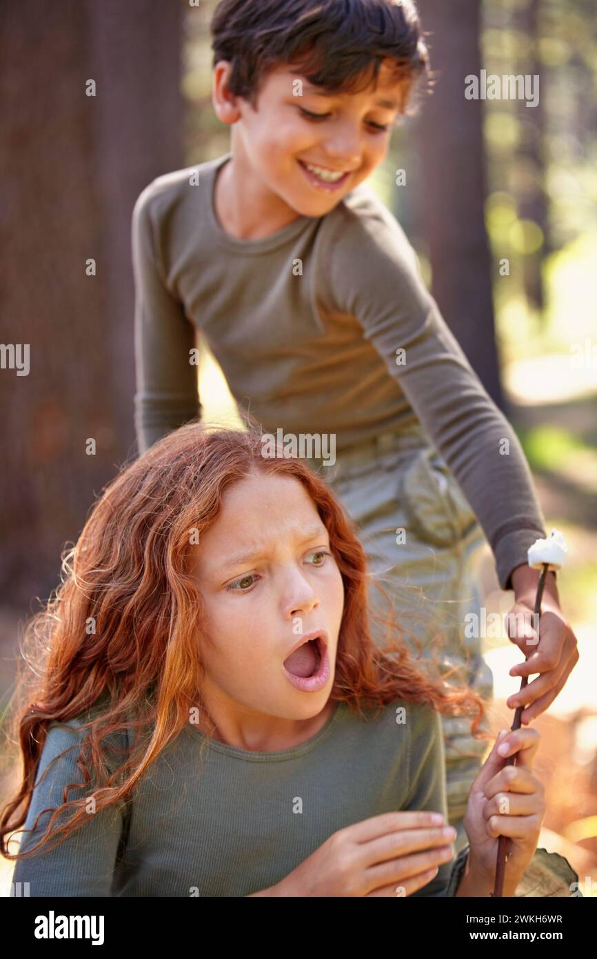 Shock, children and surprise with food outdoor, boy stealing snack and ...