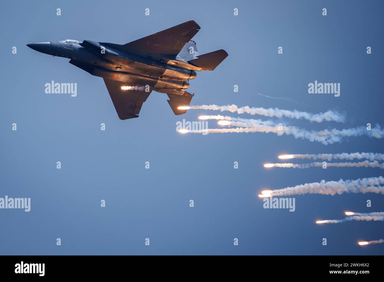 A Singaporean Air Force's F-15SG fighter jet releases flares during an ...