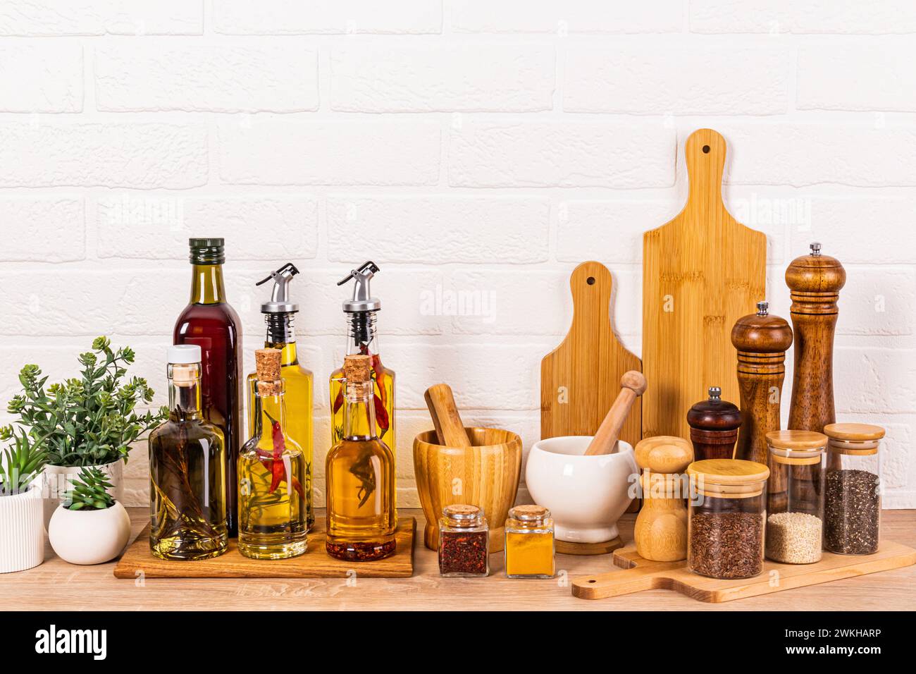 Stylish kitchen background with a set of bottles with various cooking ...