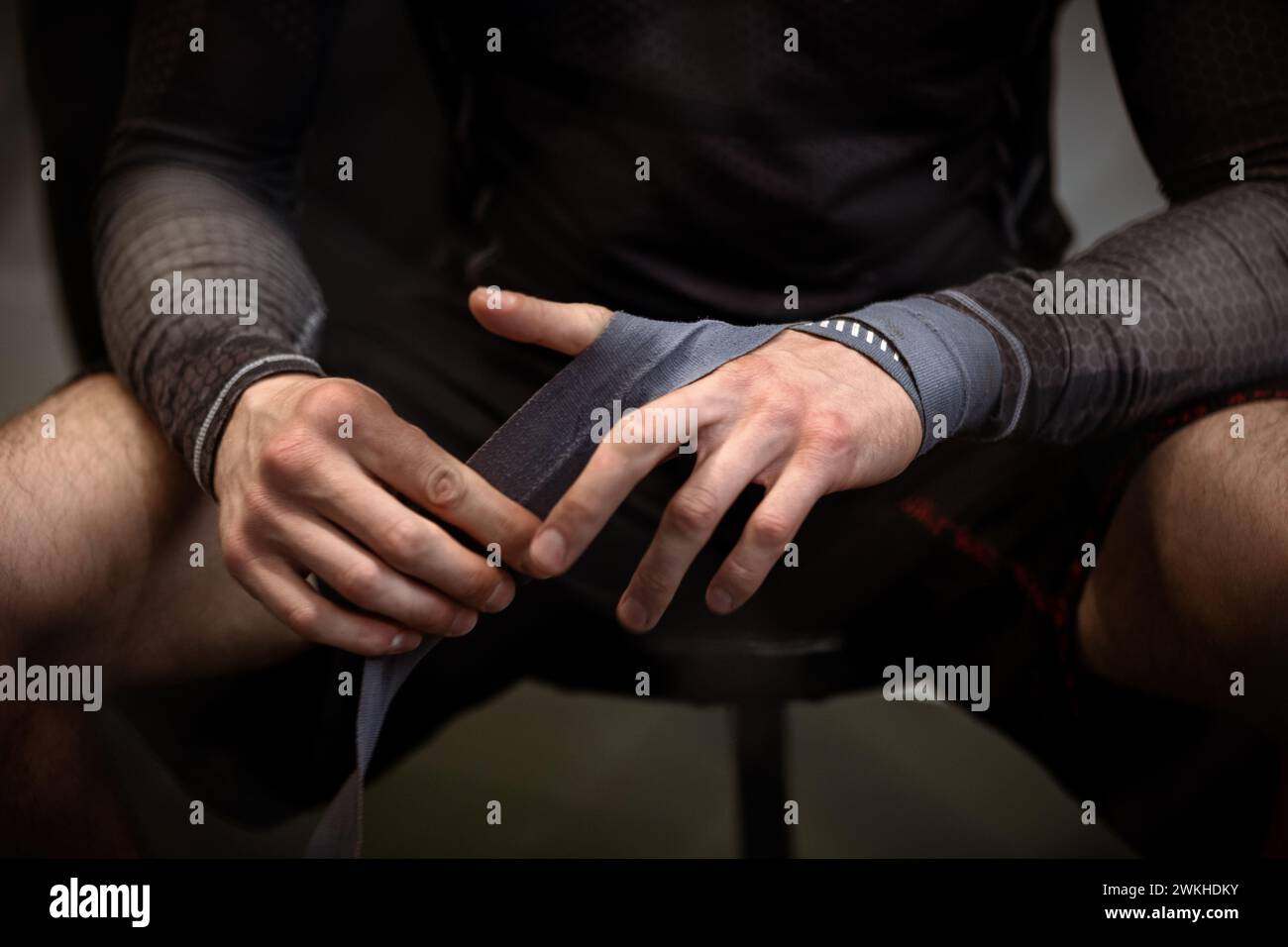 Boxer wrapping hands with boxing handwraps before training Stock Photo ...