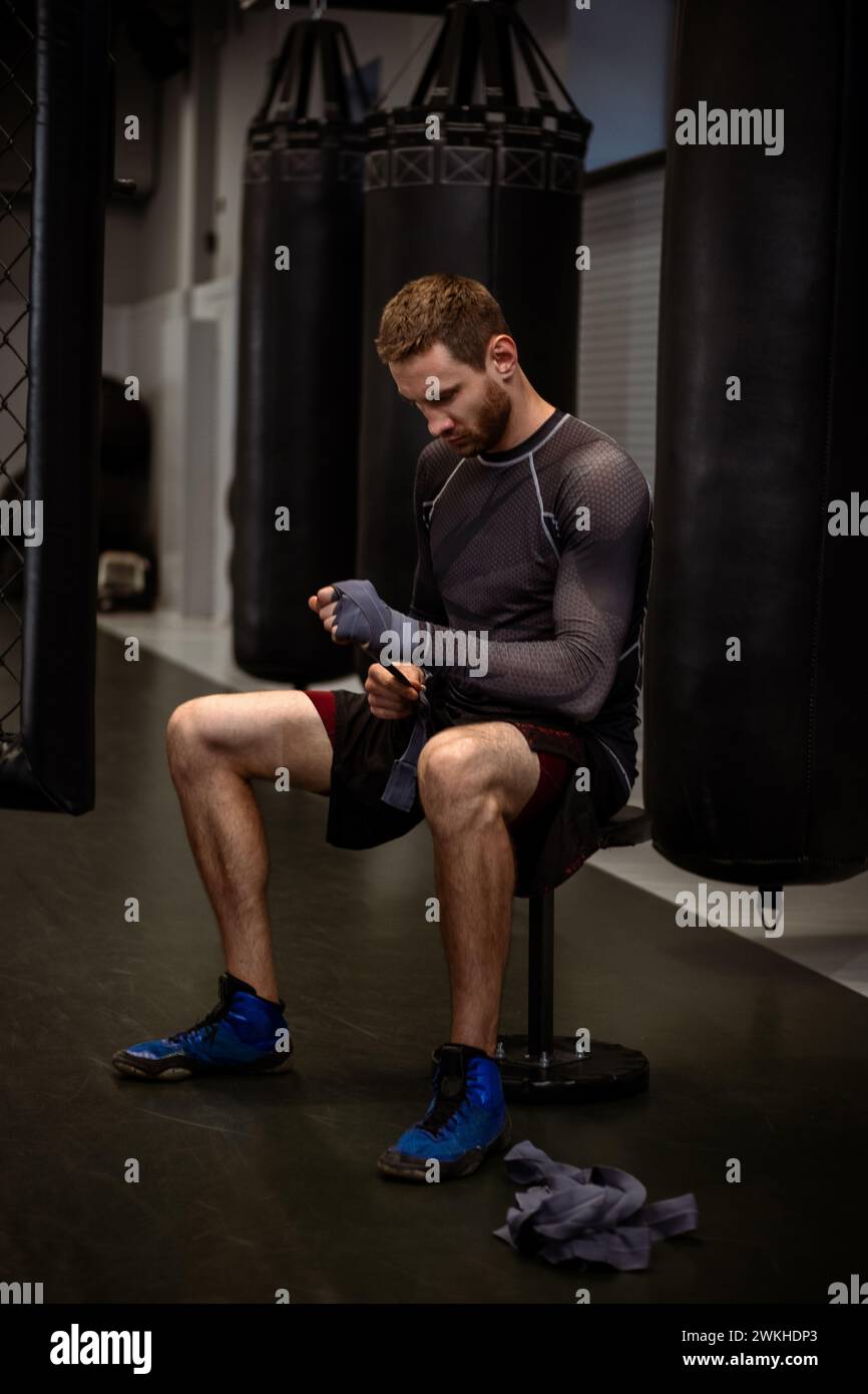 Man wrapping hands before training hi-res stock photography and images ...