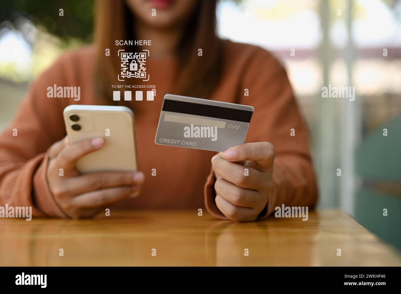 Woman scanning verification QR code login to bank account on mobile ...