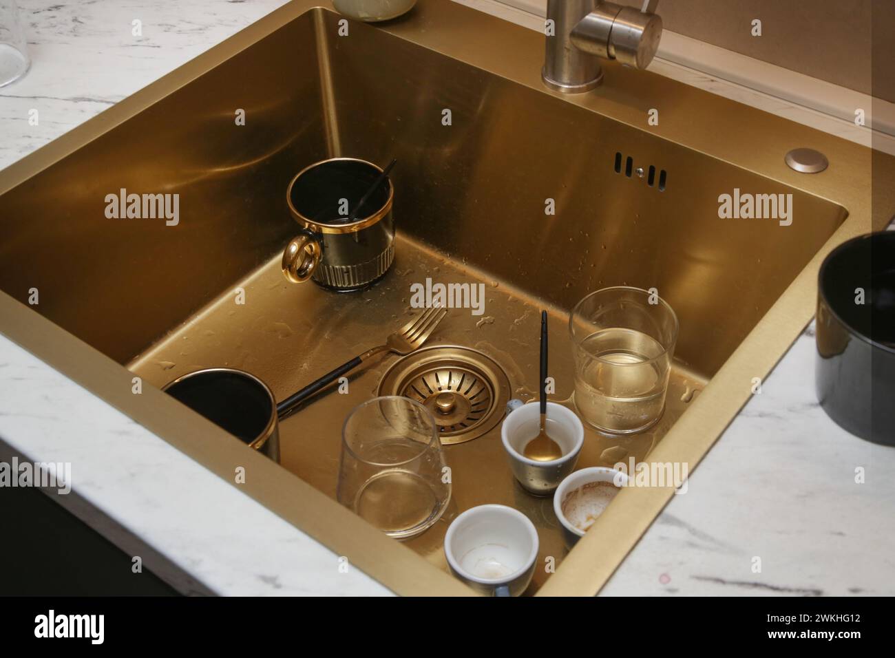 Dirty dishes in kitchen sink Stock Photo - Alamy