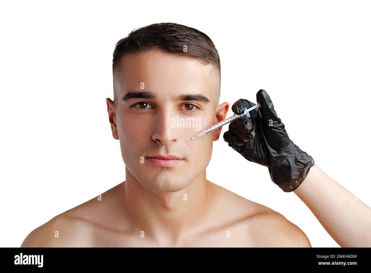 Handsome young man face and beautician hands with syringe making ...