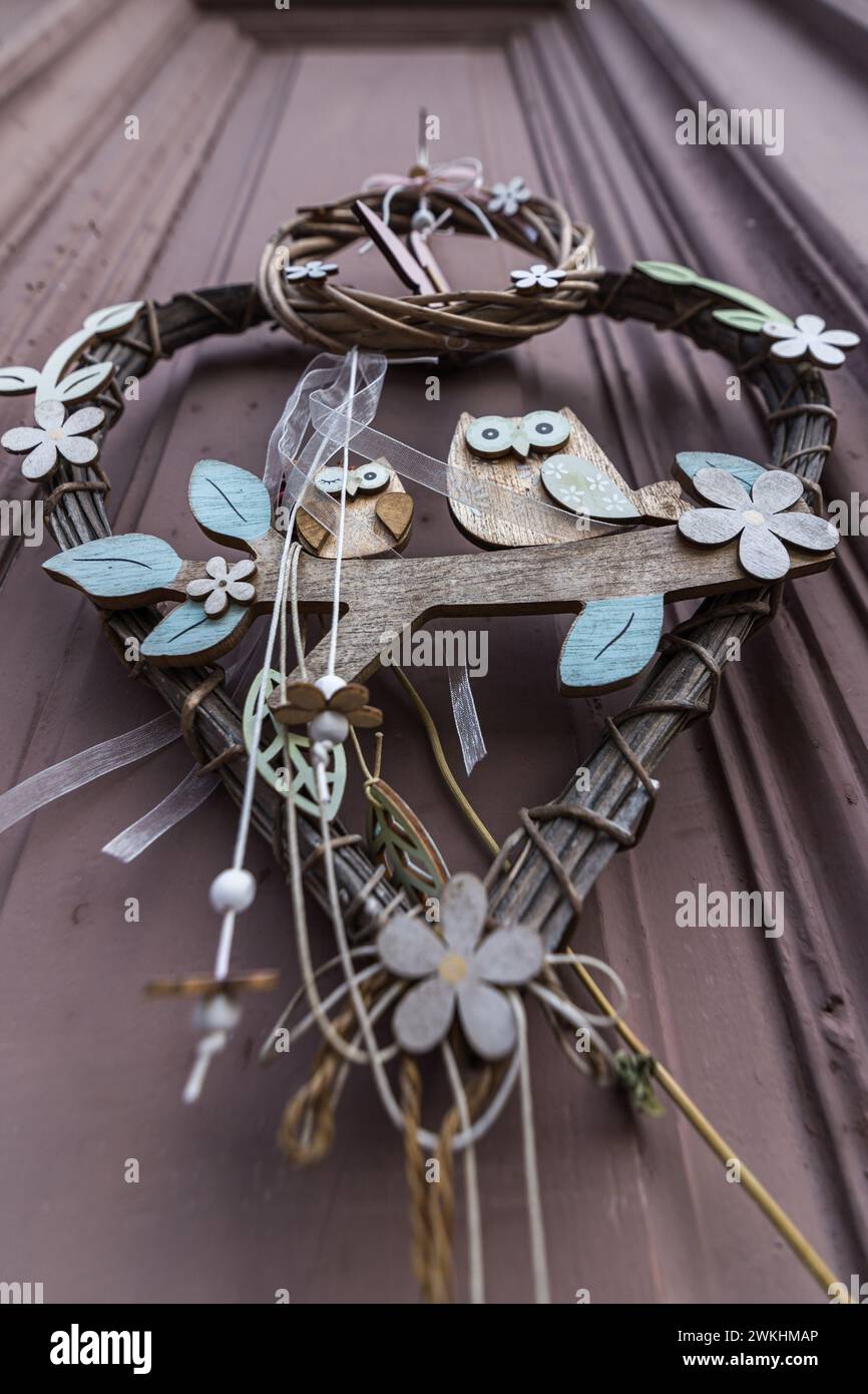 An owl hand made of wood hanging on a door outdoors Stock Photo - Alamy
