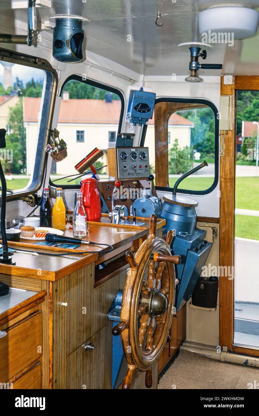 Interior in an old ship bridge with a wooden steering wheel Stock Photo ...