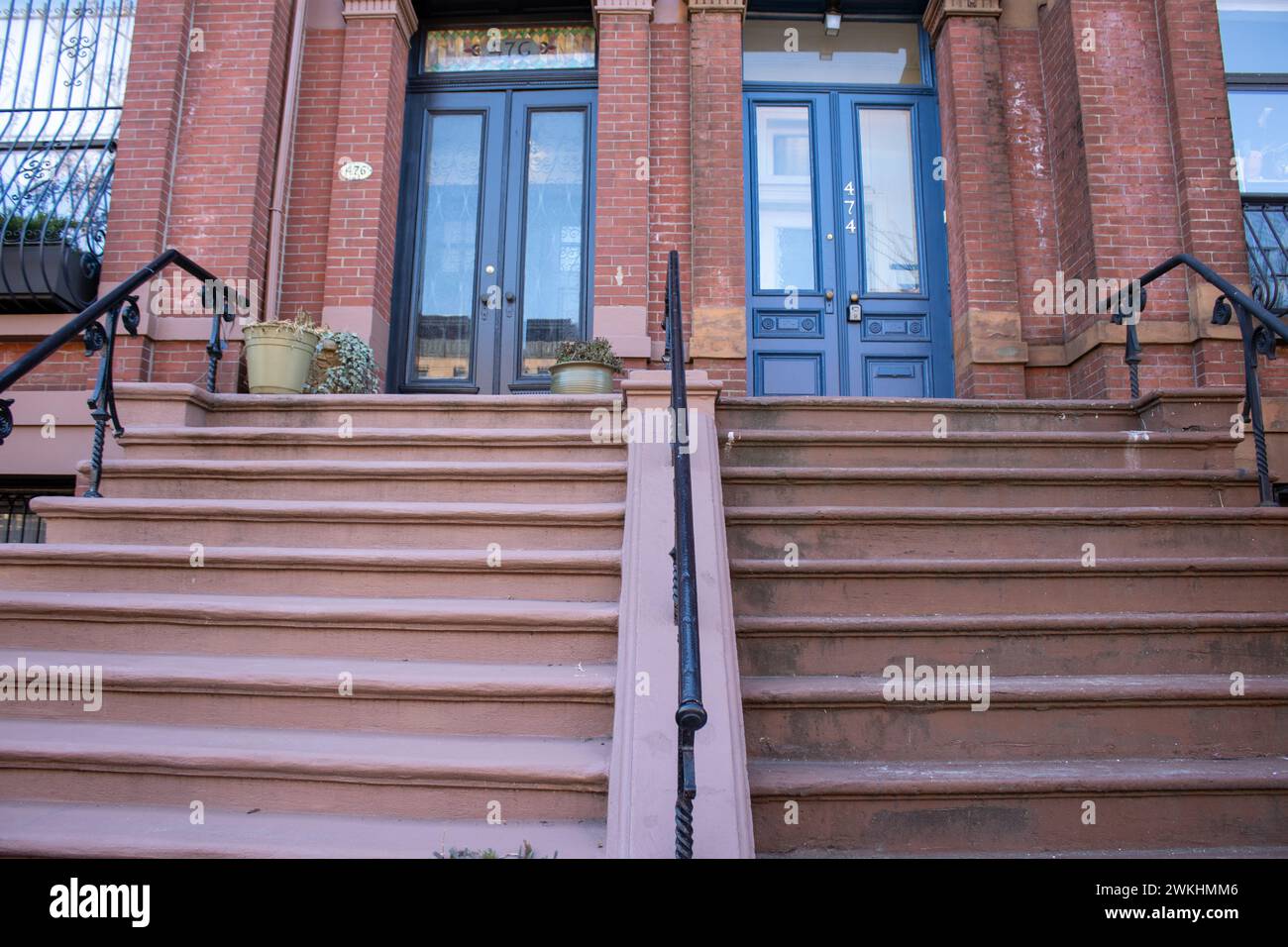 A red brick building with stairs with iron handrails in New York ...