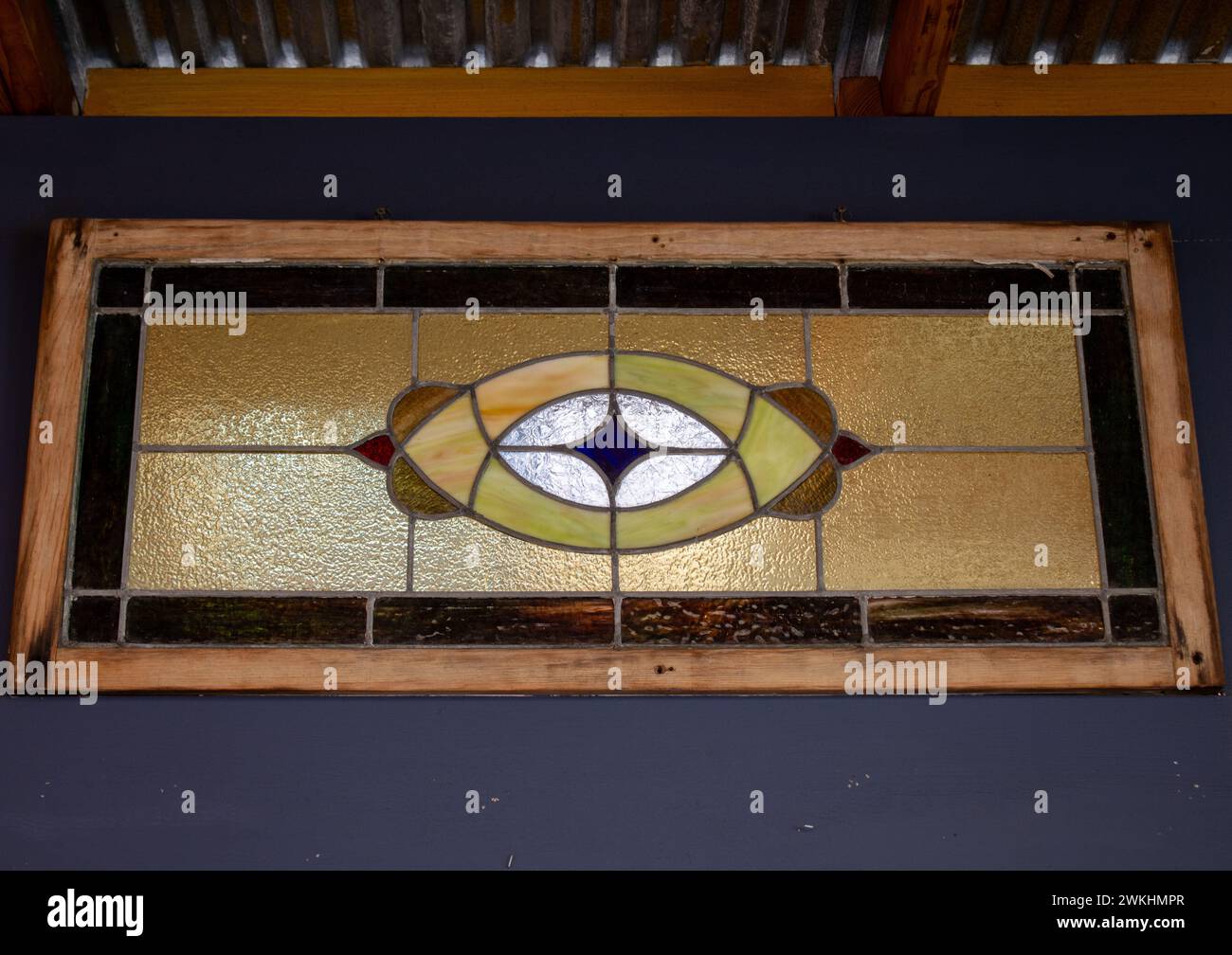 A stained glass window with wooden trim Stock Photo - Alamy