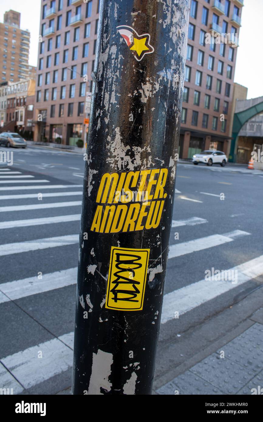 The colorful stickers covering a street pole in New York City, USA ...