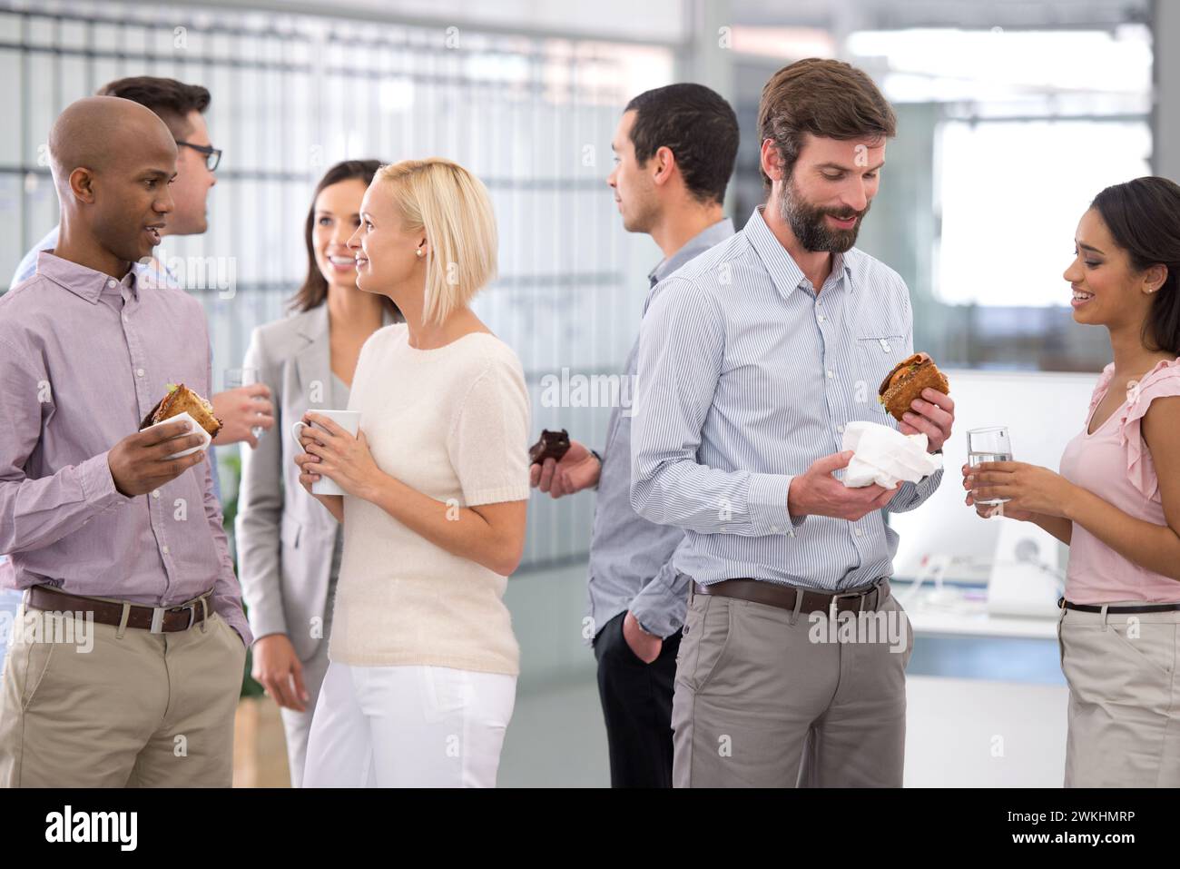 Business people, group and lunch in office with conversation, chat and ...