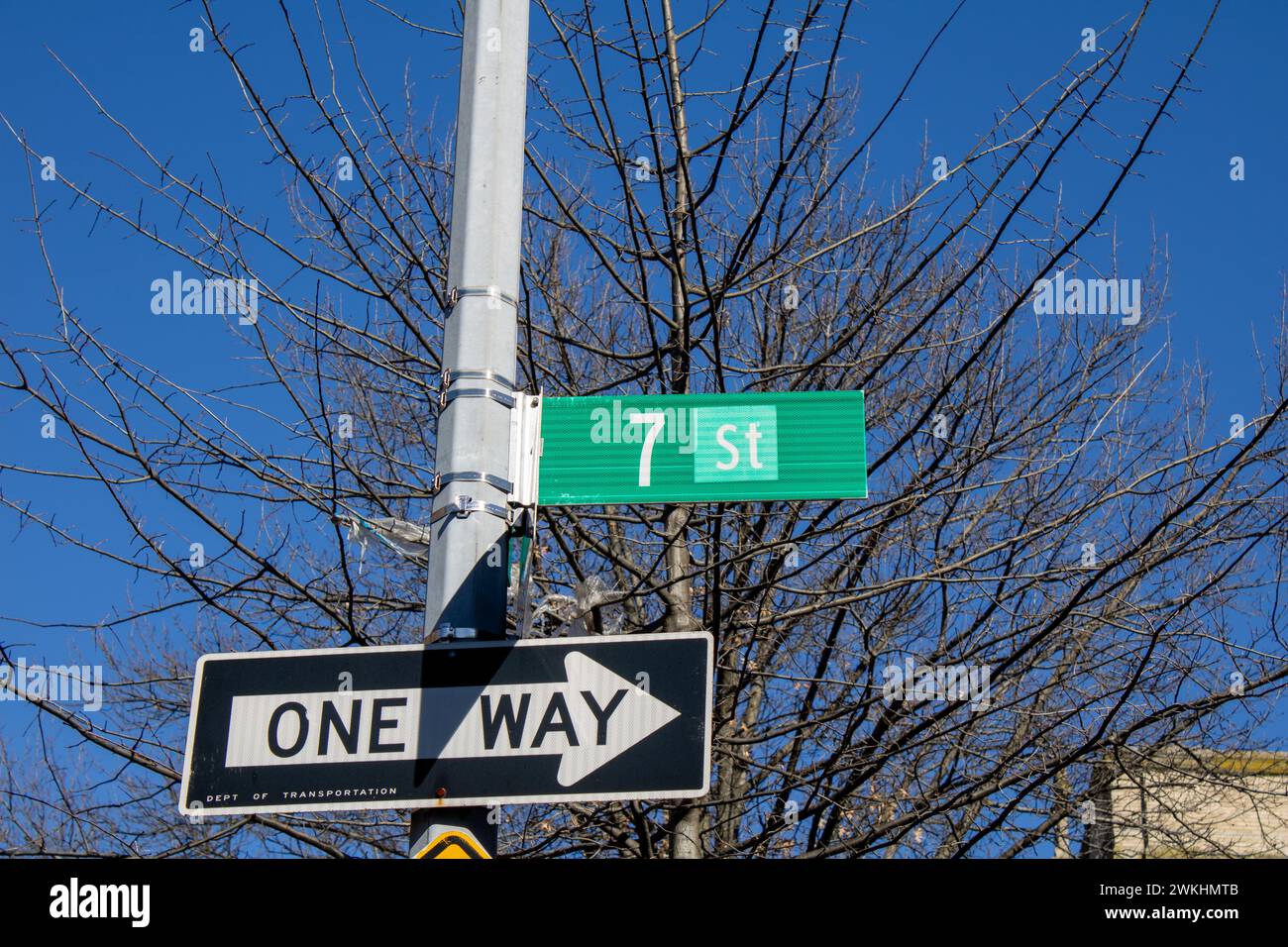 The two street signs hanging from a pole on a roadside Stock Photo - Alamy