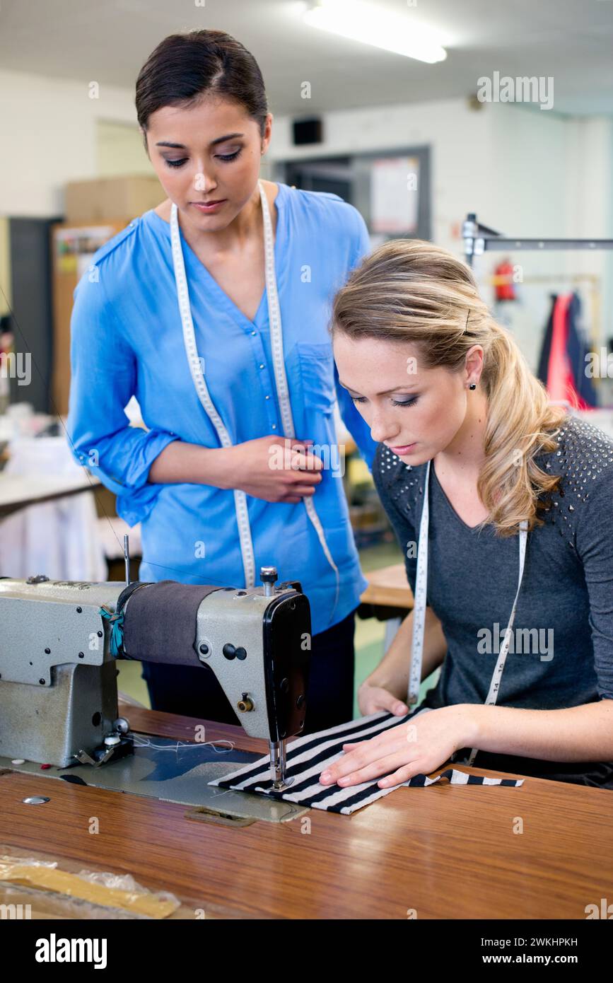 Woman teaching sewing machine hi-res stock photography and images - Alamy