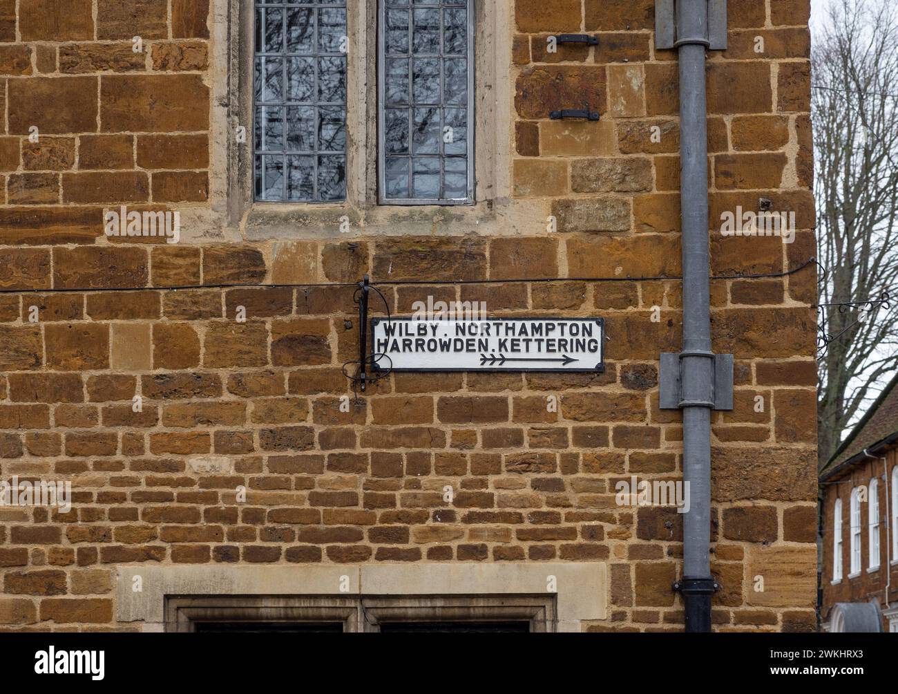 Old road sign with directions to Wilby, Northampton, Harrowden and ...