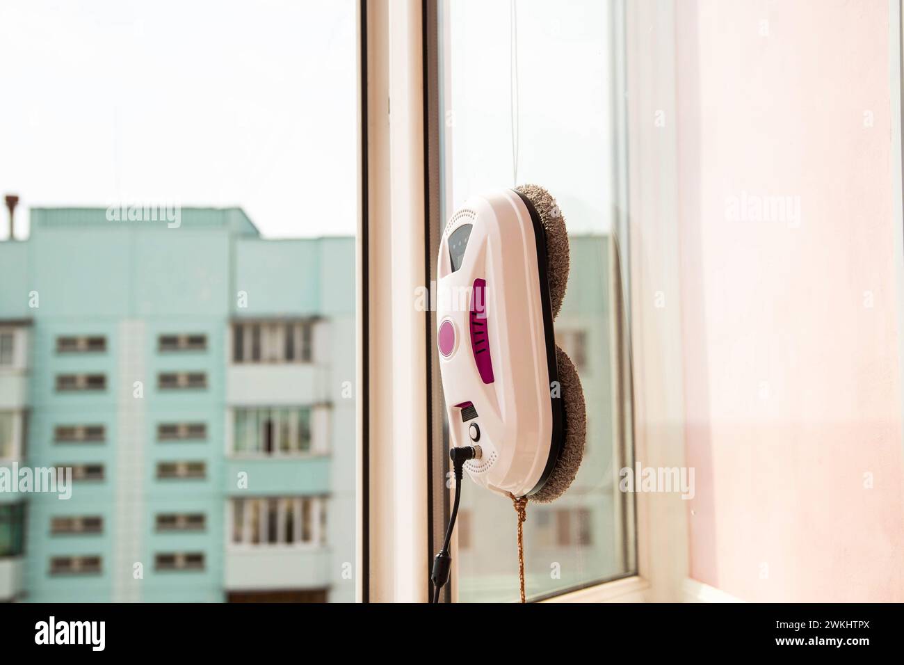 Automatic vacuum robot window washer washes glass from dirt. Modern ...