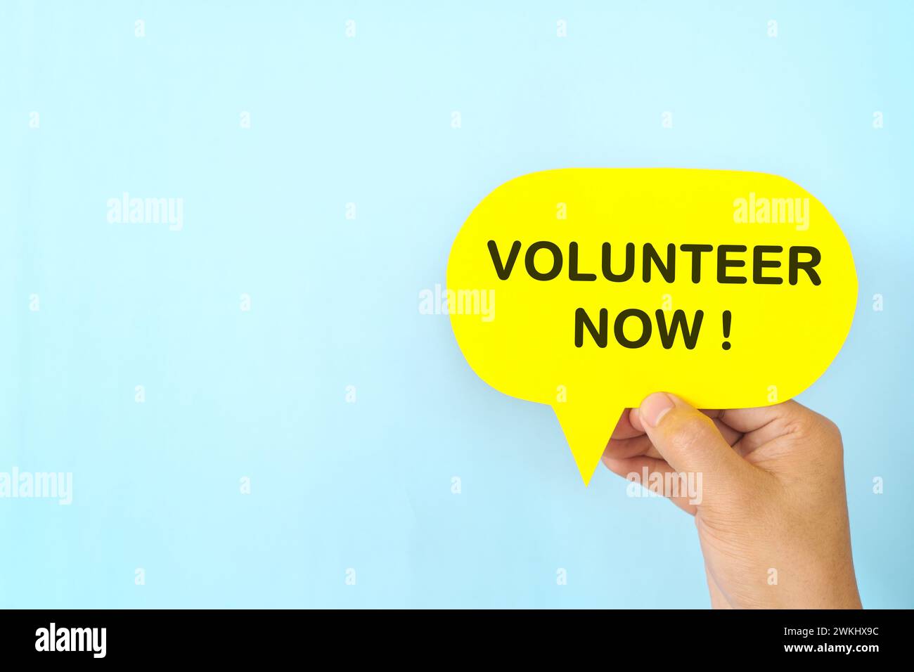 Human hand holding yellow speech bubble signage with written phrase ...