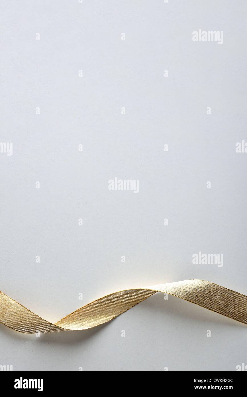 Shiny gold ribbon with ripples at the bottom on isolated white ...