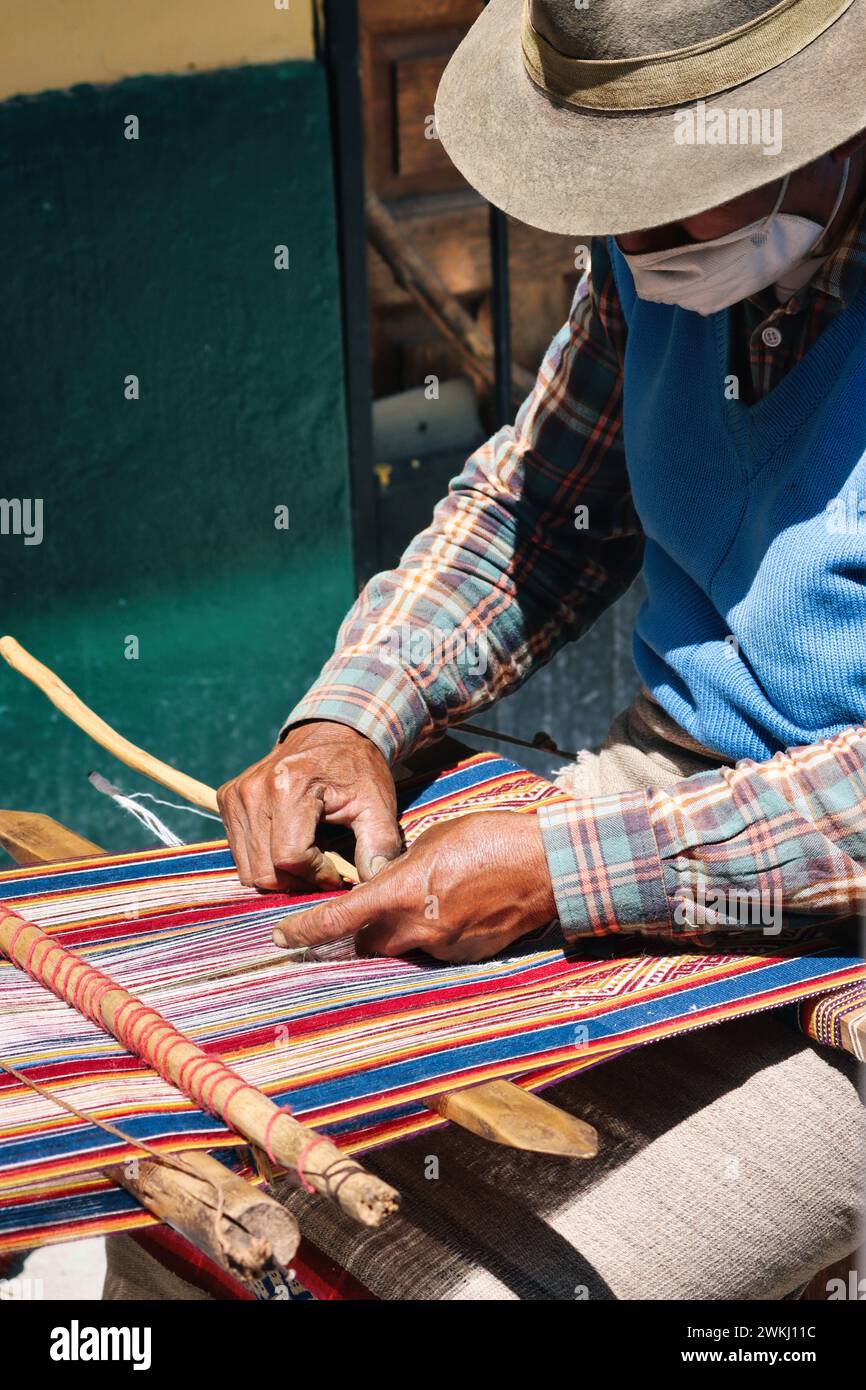 This photo showcases a skilled peruvian artisan donning a hi-res stock ...