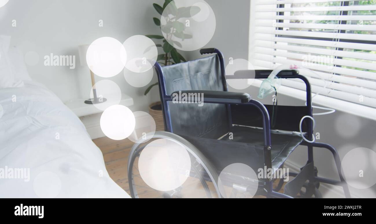Image of spots over wheelchair Stock Photo - Alamy