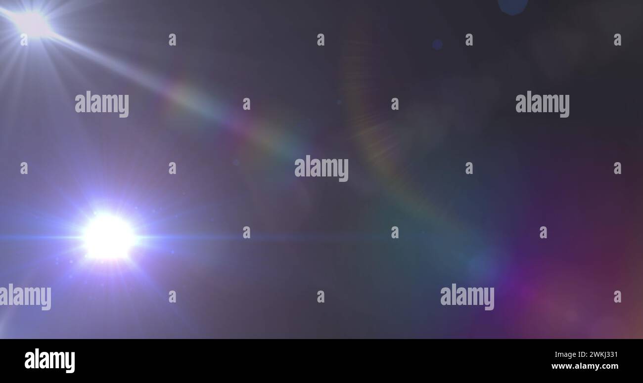 Image of spotlight with lens flare over dark background Stock Photo - Alamy