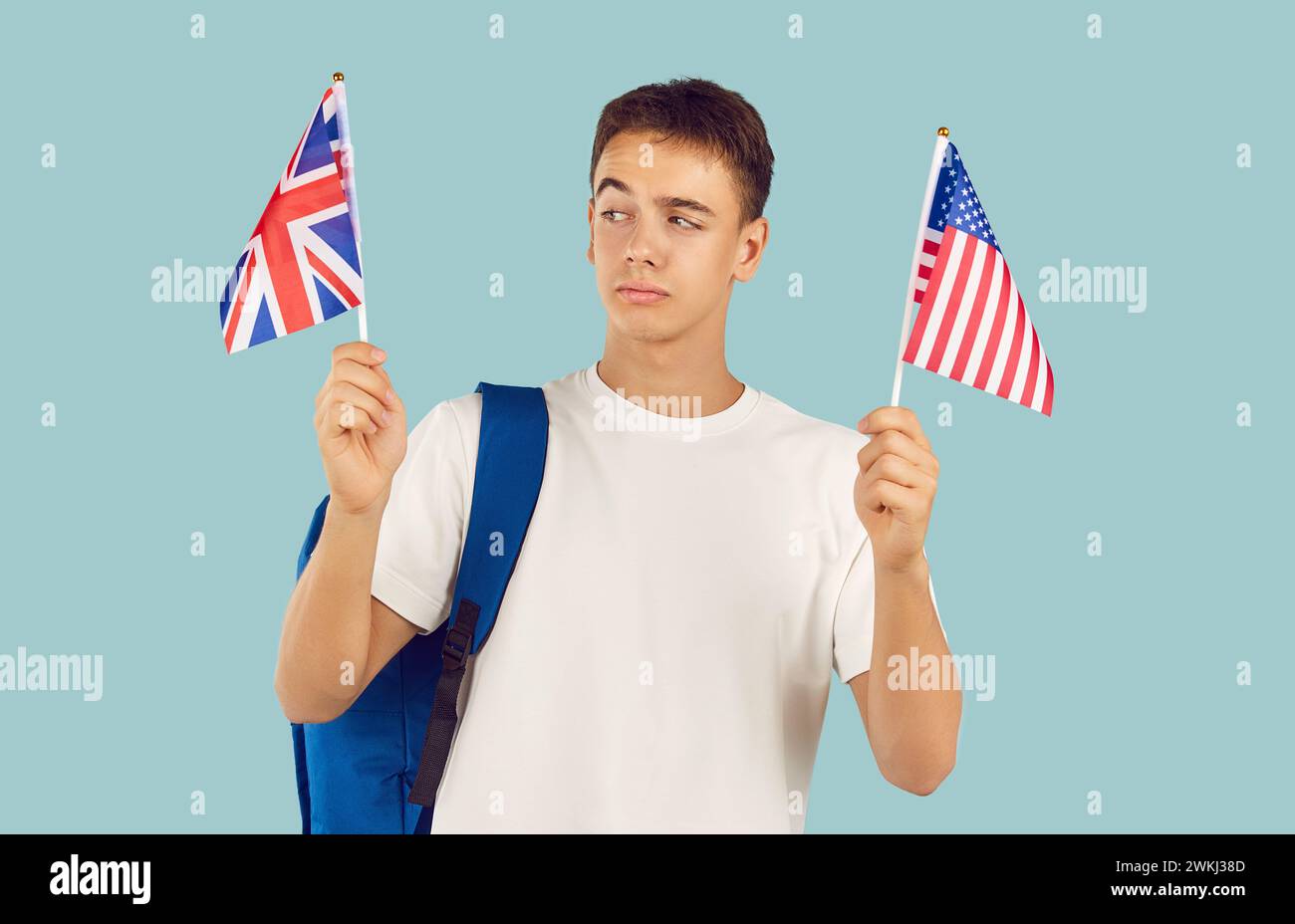 Boy student holding the flags of Great Britain and United States of ...