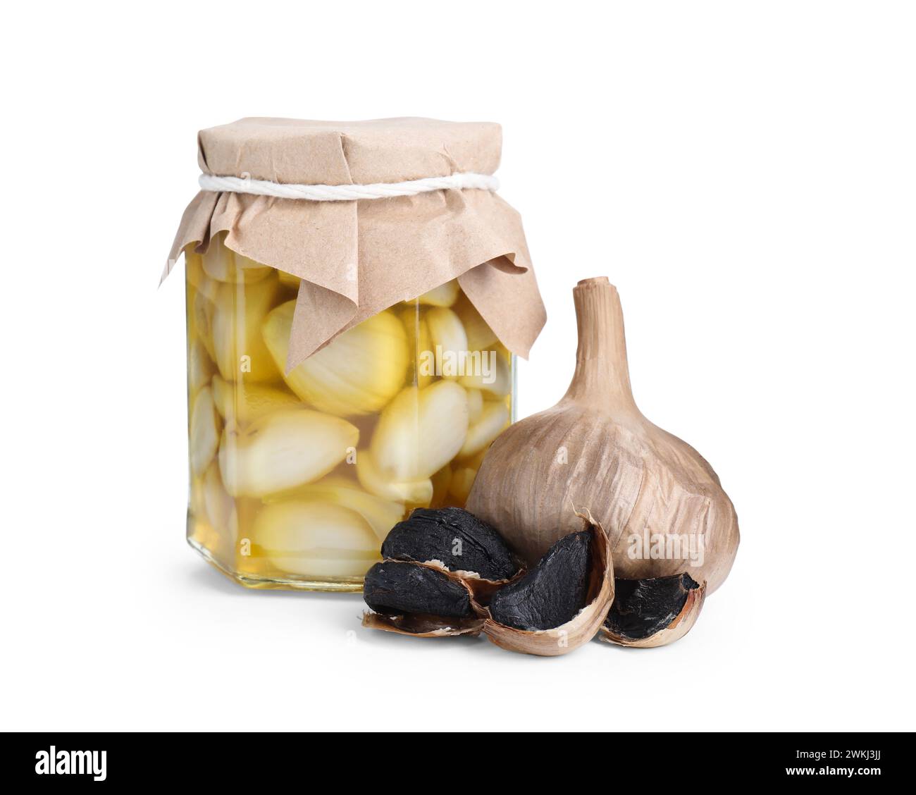Garlic with honey in glass jar and fermented black garlic isolated on ...
