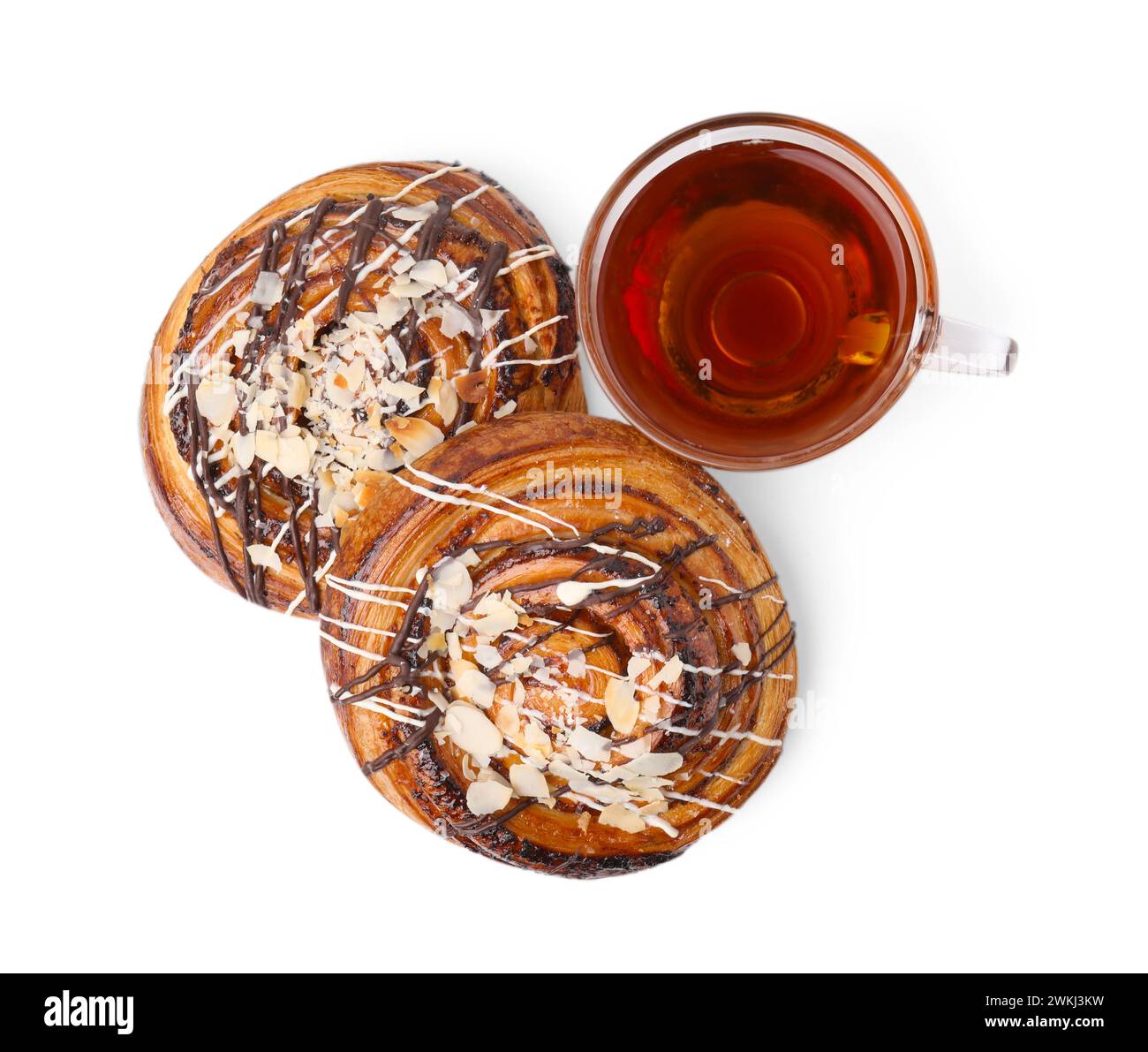 Delicious rolls with toppings, almond and cup of tea isolated on white ...