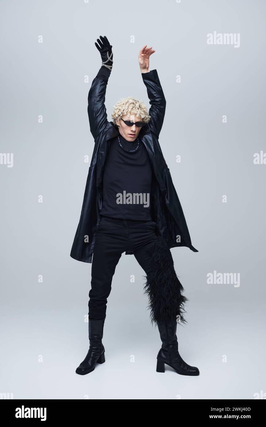 Stylish, handsome young man show modern twist on gothic fashion with ...