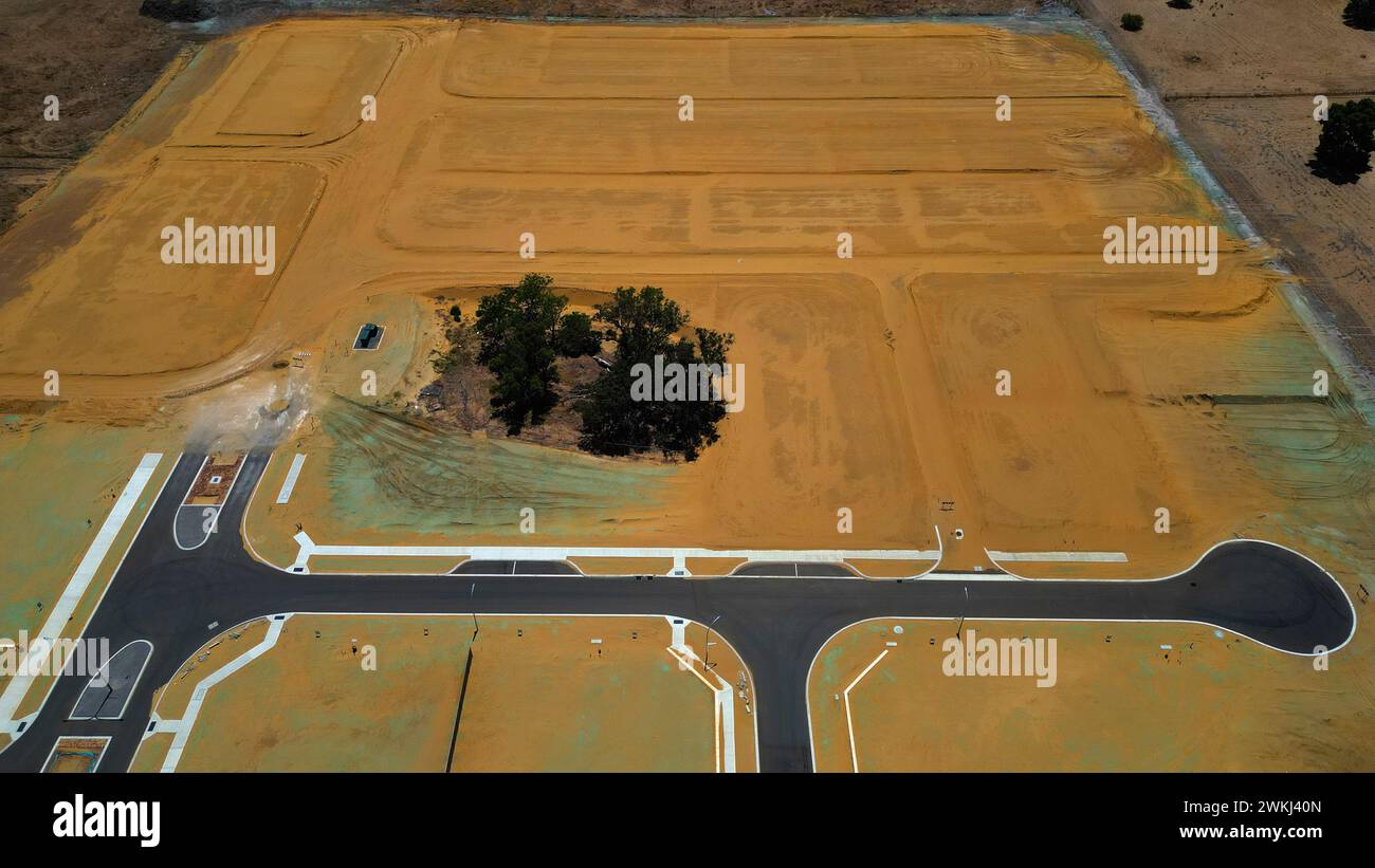 An aerial view of a new housing project expanding into countryside with ...