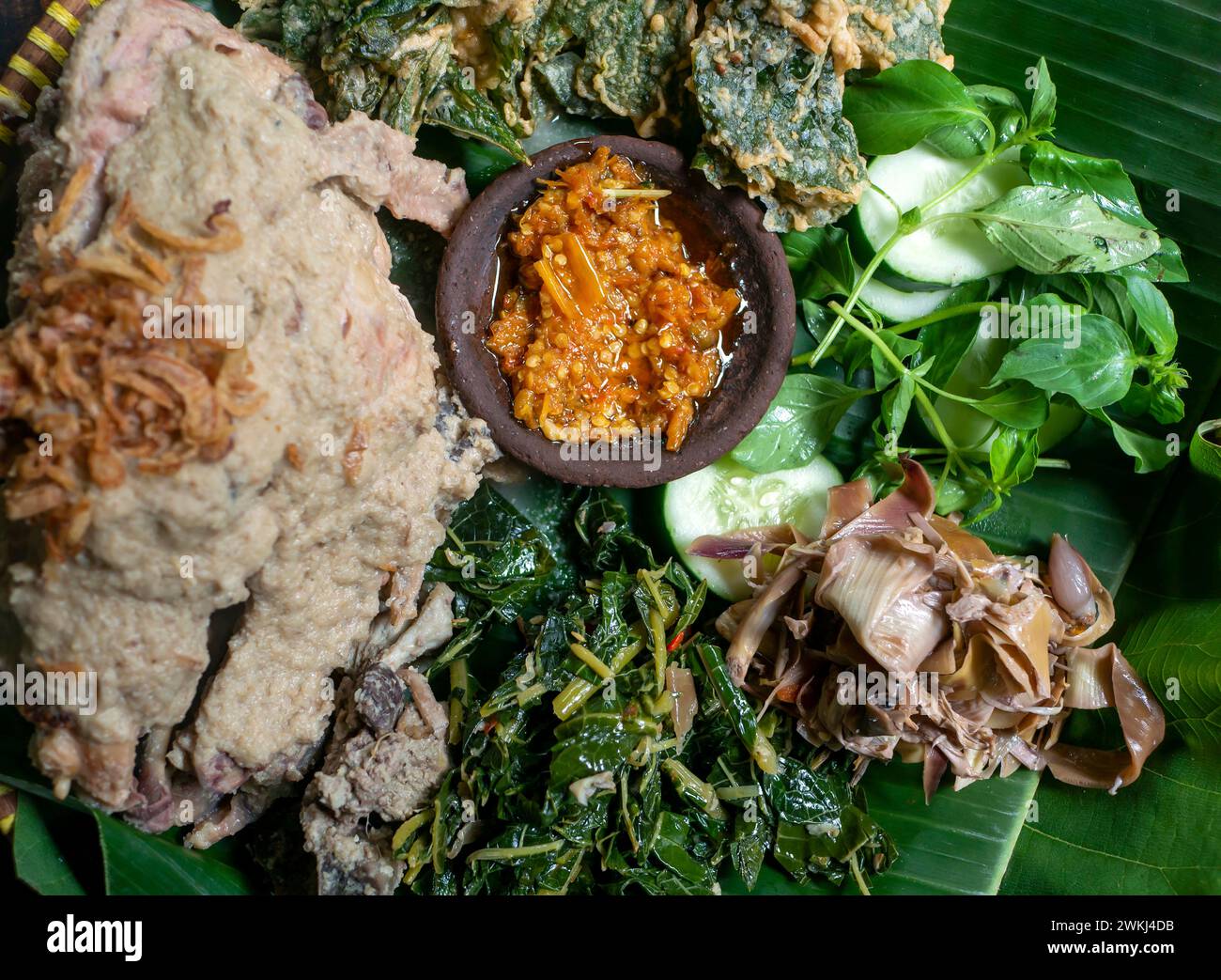 Ingkung Ayam, a traditional food from Yogyakarta, Indonesia, with spicy ...