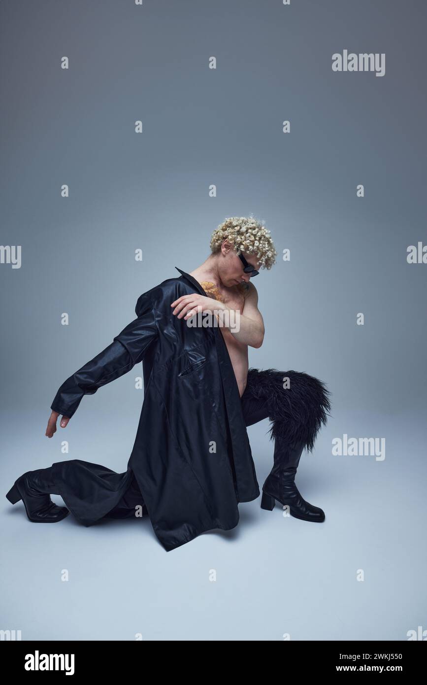 Flexible male model performing dramatic dance pose. Young attractive ...