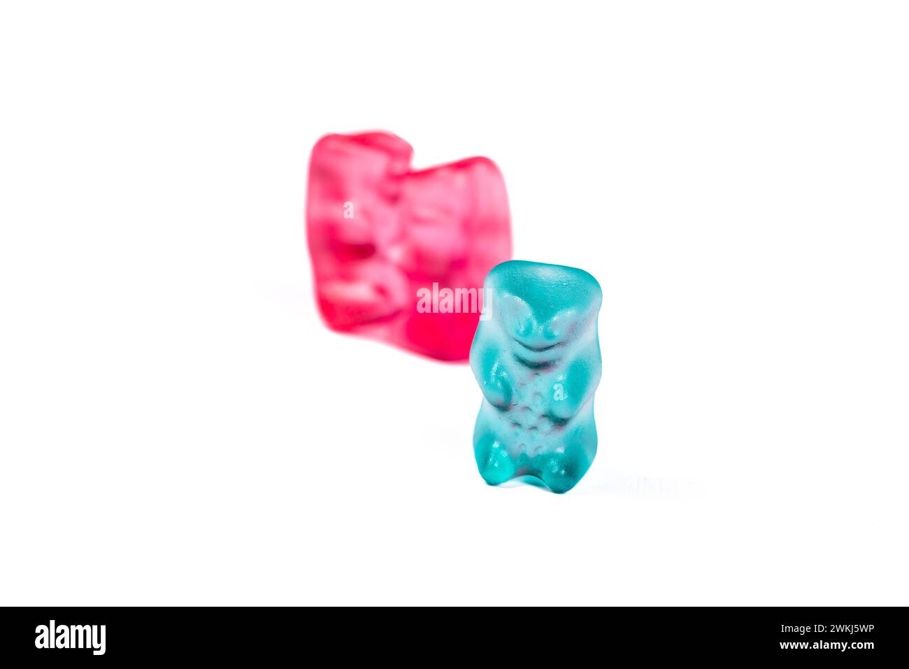 Sweet Love Triangle: Red Gummibears Embrace, While a Green Bear Plays ...