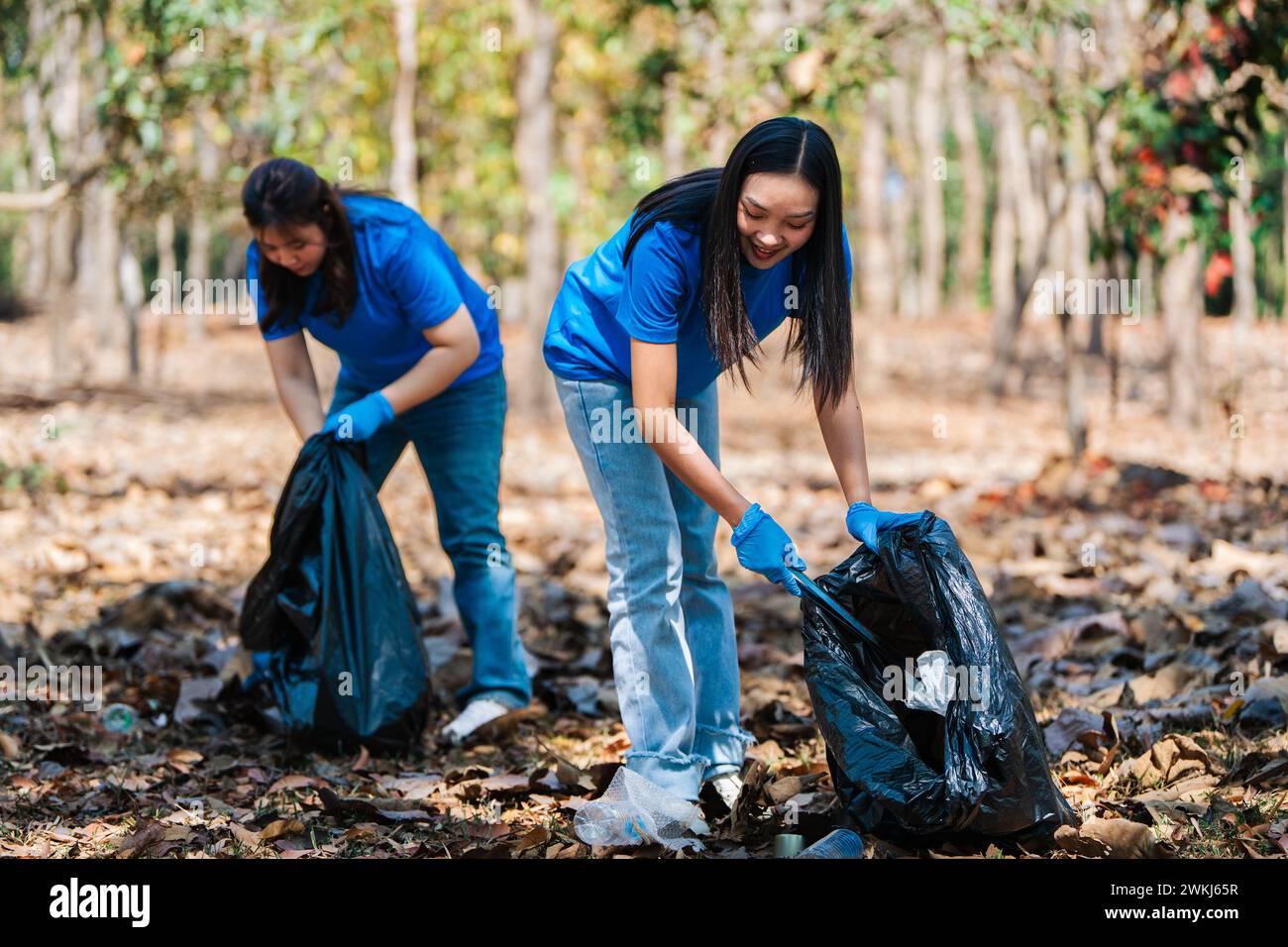 Group of volunteers, community members cleaning the nature from garbage ...