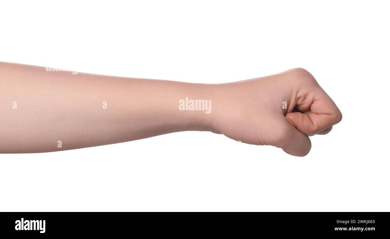 Playing rock, paper and scissors. Woman showing fist on white ...