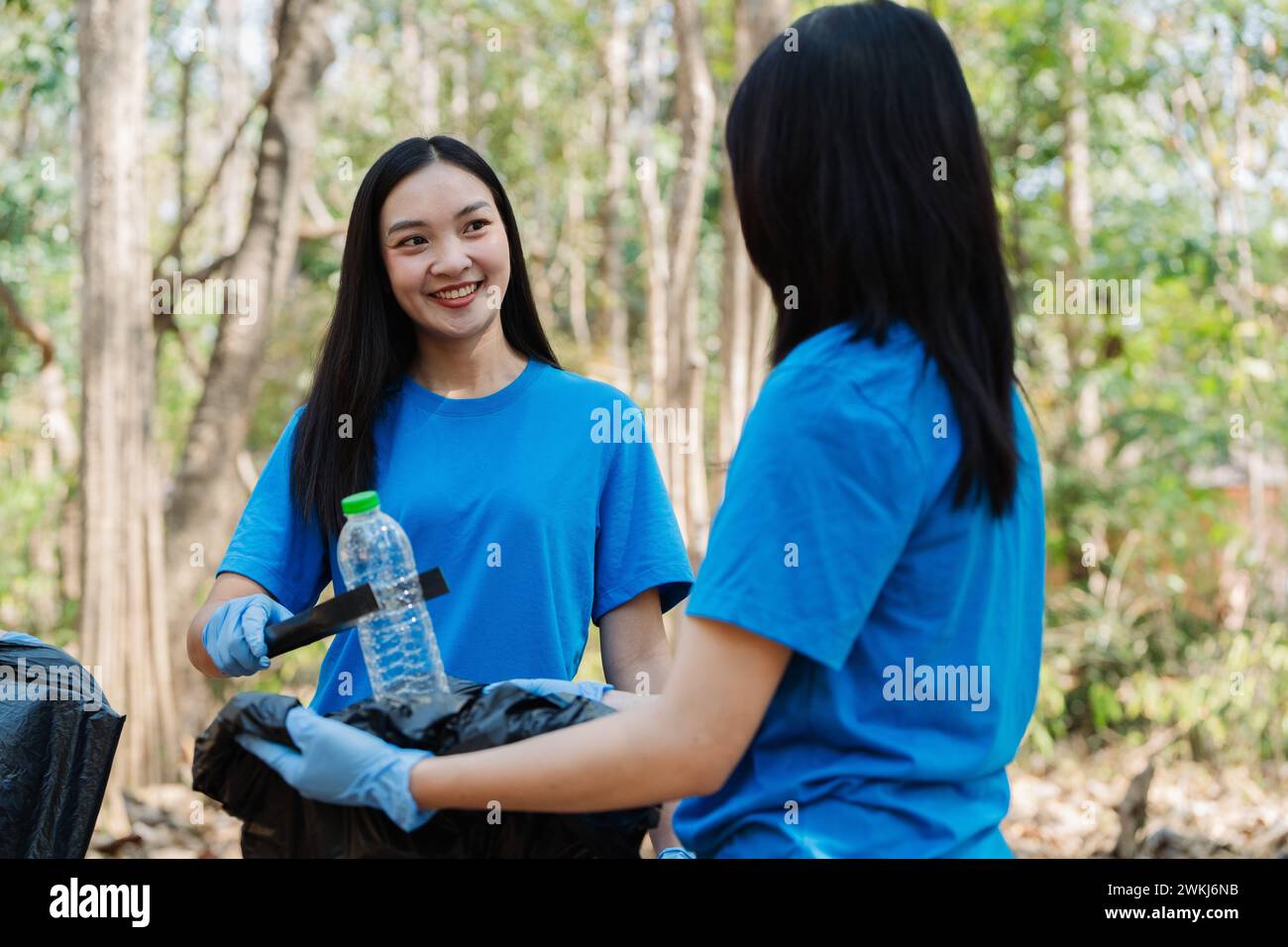 Group of volunteers, community members cleaning the nature from garbage ...
