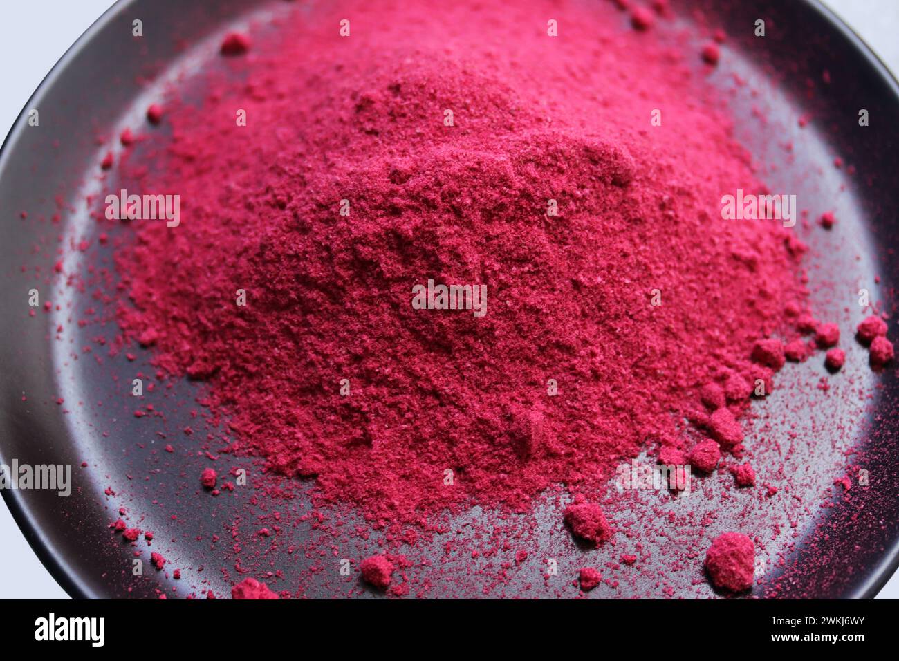 Raspberry fruit powder close-up. Studio shot Stock Photo - Alamy