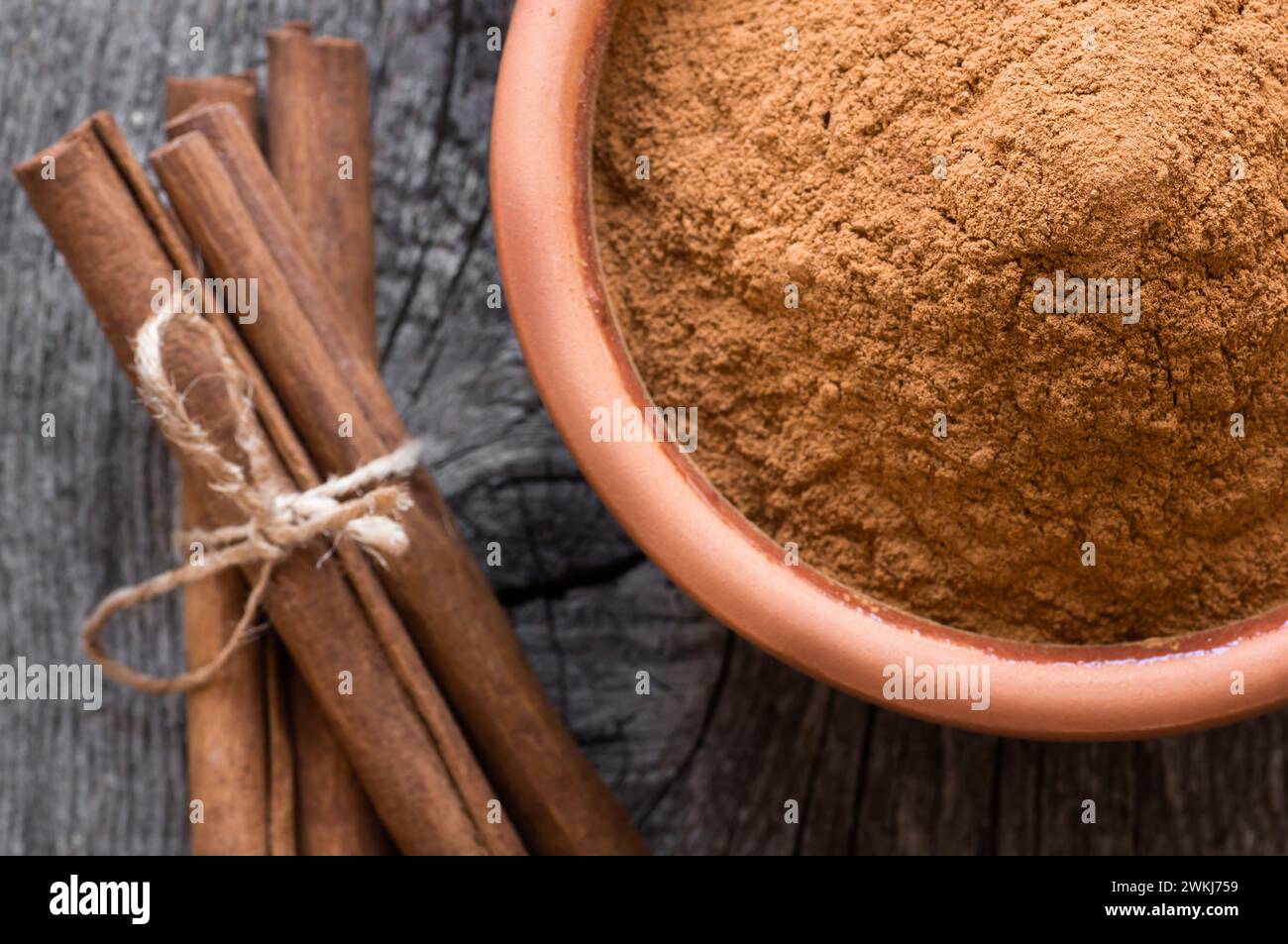 Cinnamon sticks and cinnamon powder on rustic background, healthy spice ...
