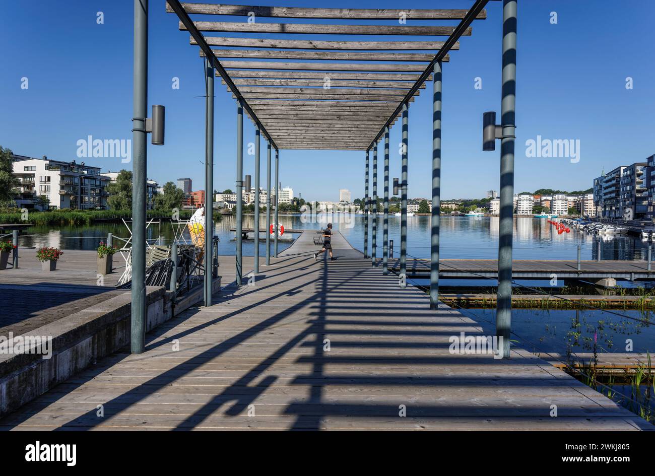 Early morning runner jogger on Lugnets terrass or terrace by Hammarby ...